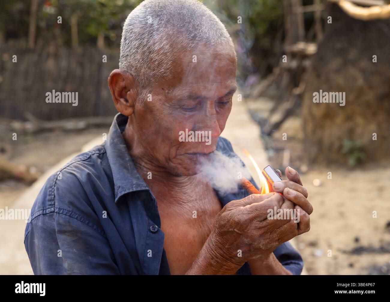 Marma old man smoking a cigar, Chittagong Division, Rowangchhari ...