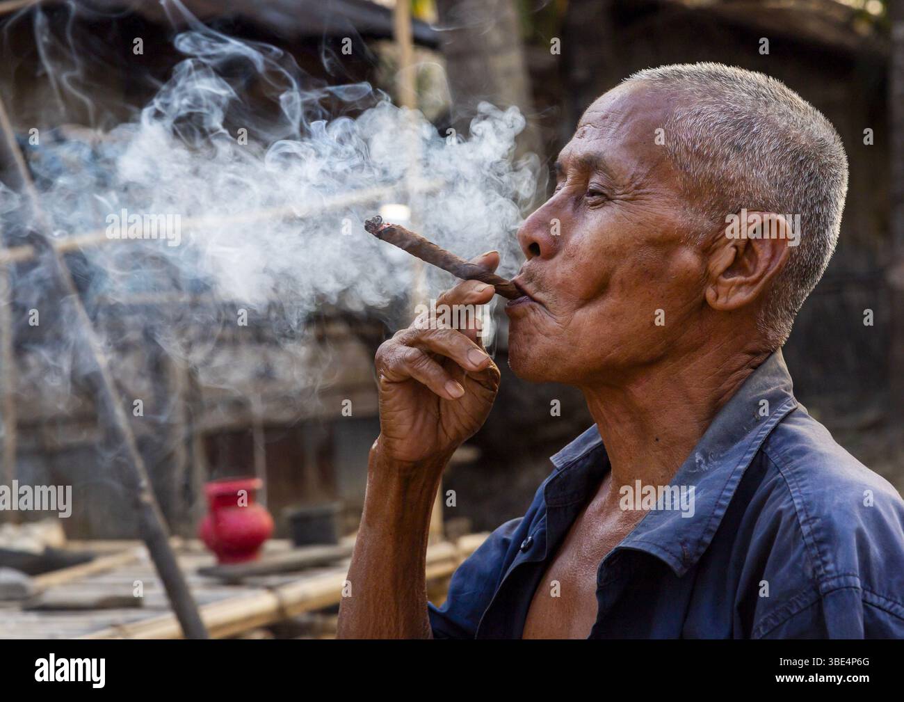 Marma old man smoking a cigar, Chittagong Division, Rowangchhari ...