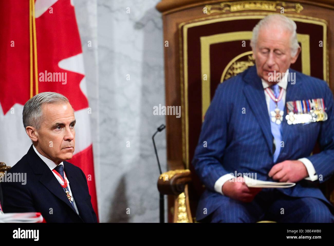 Canadian Prime Minister Mark Carney listens as King Charles III ...