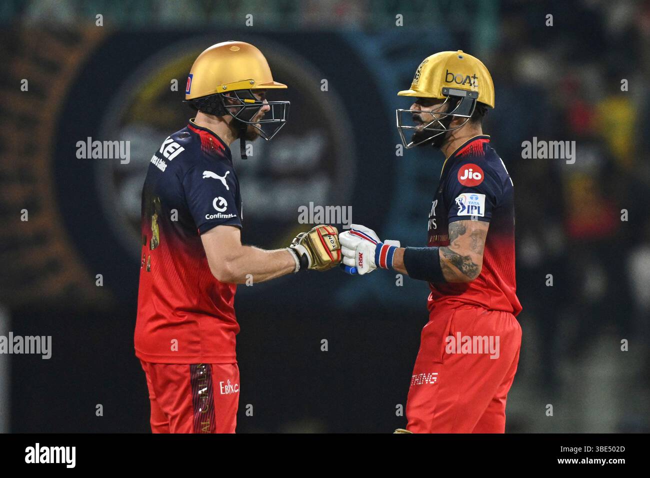 Royal Challengers Bengaluru's Virat Kohli, right, fist bumps with his ...