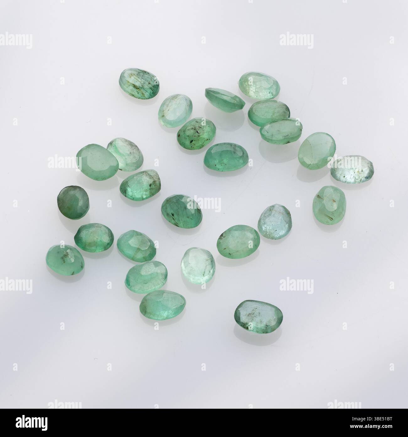 A captivating arrangement of loose, unpolished natural emerald ...
