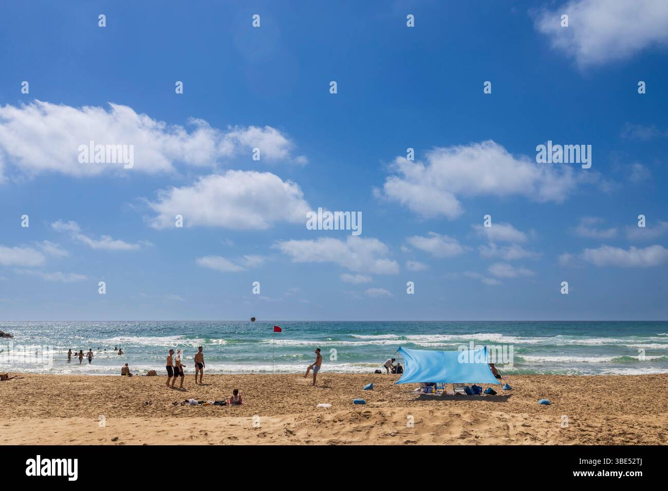 Haifa, Israel – May 24, 2025. Men playing beach volleyball, people ...