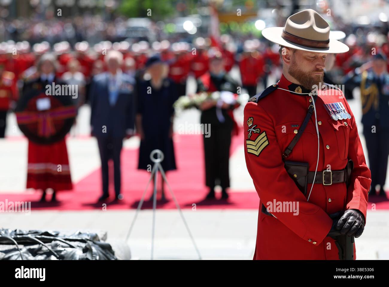 A Royal Canadian Mounted Police (RCMP) officer stands guard as King ...