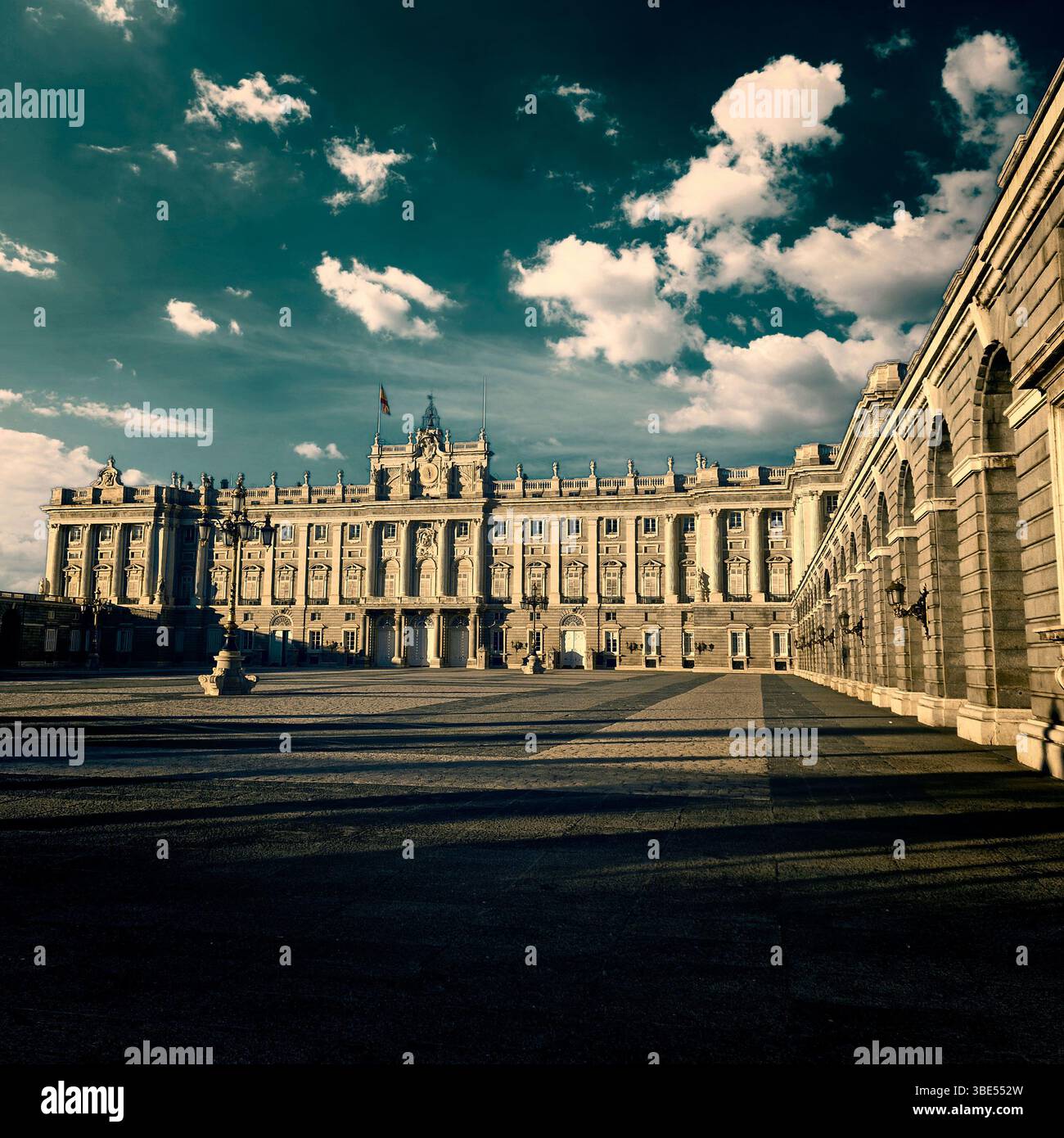 Majestic Royal Palace of Madrid under dramatic skies. Iconic Spanish ...