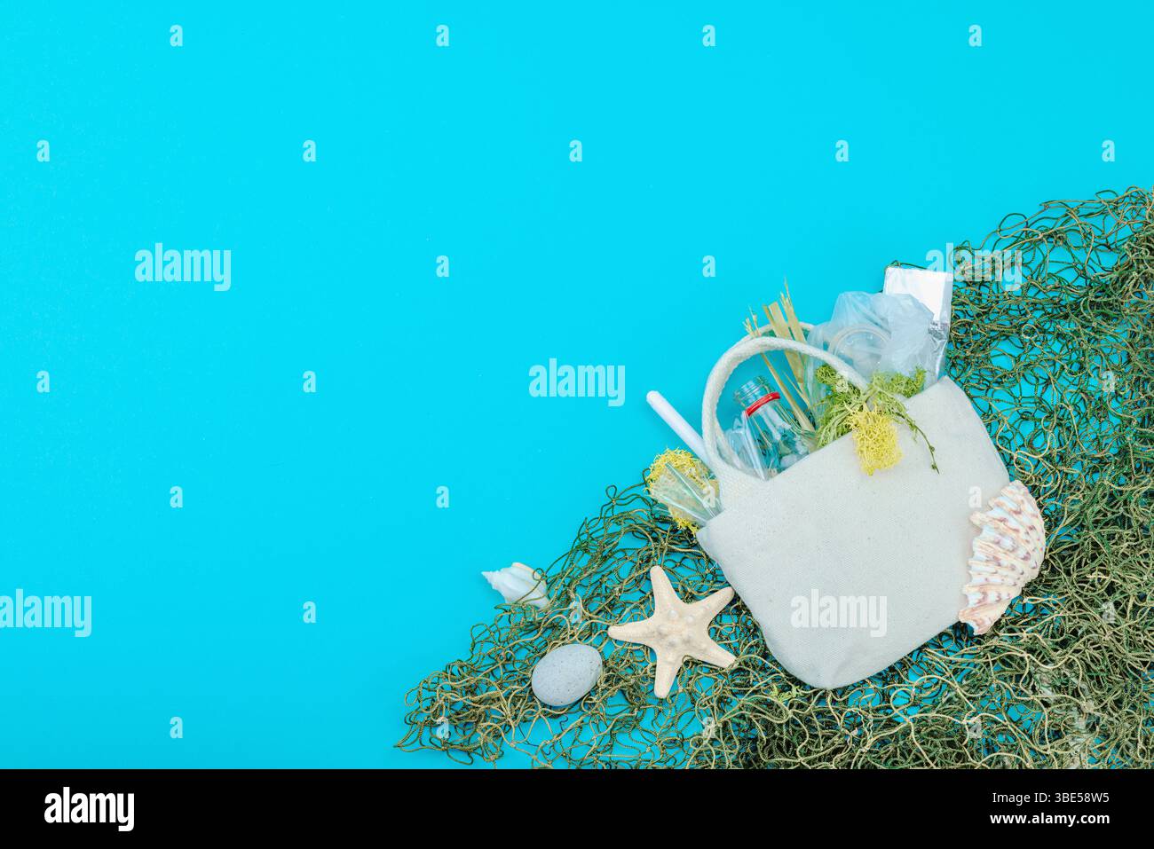 World Oceans Day concept. Fishing net, sea star, shells, and reusable ...