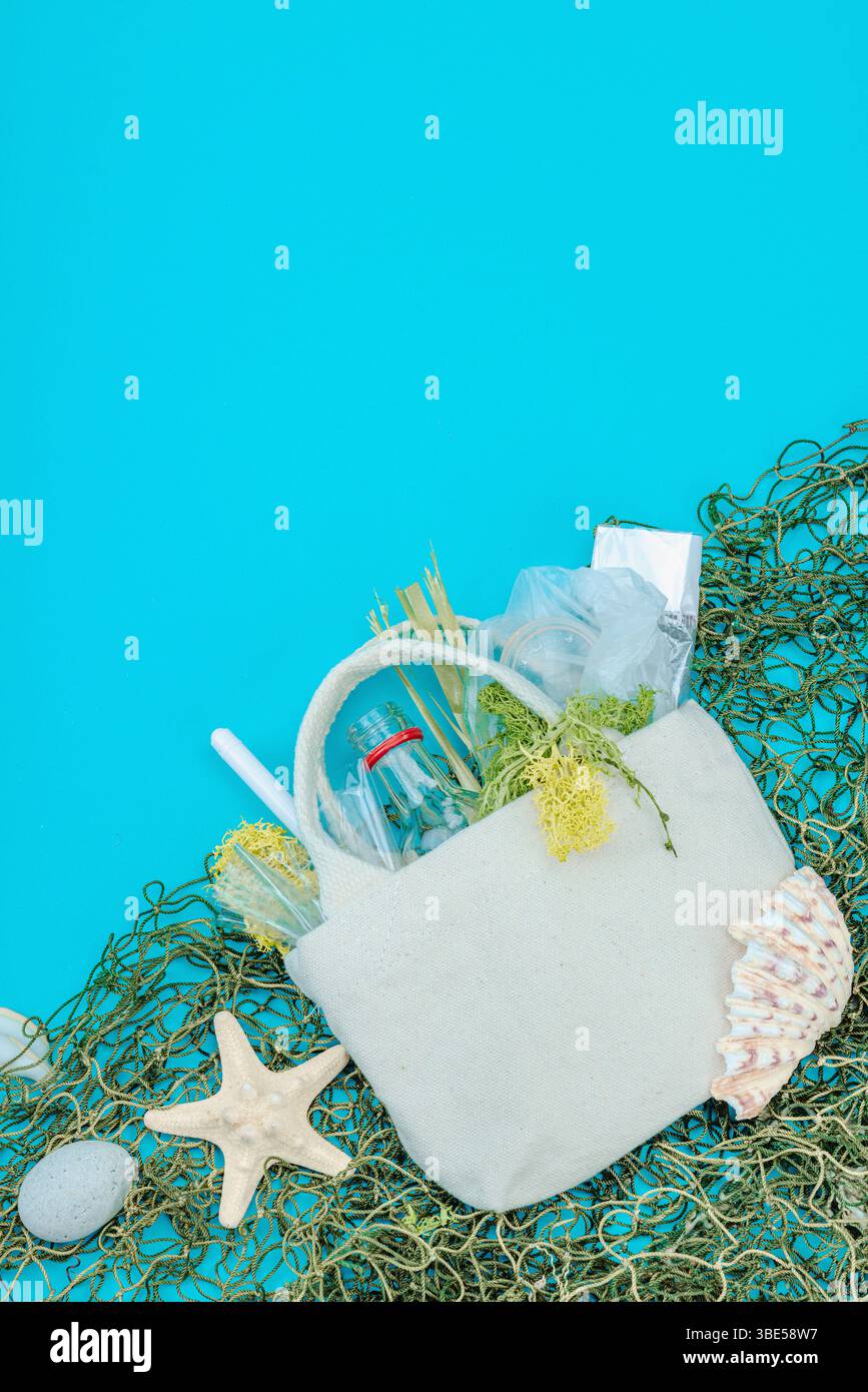 World Oceans Day concept. Fishing net, sea star, shells, and reusable ...
