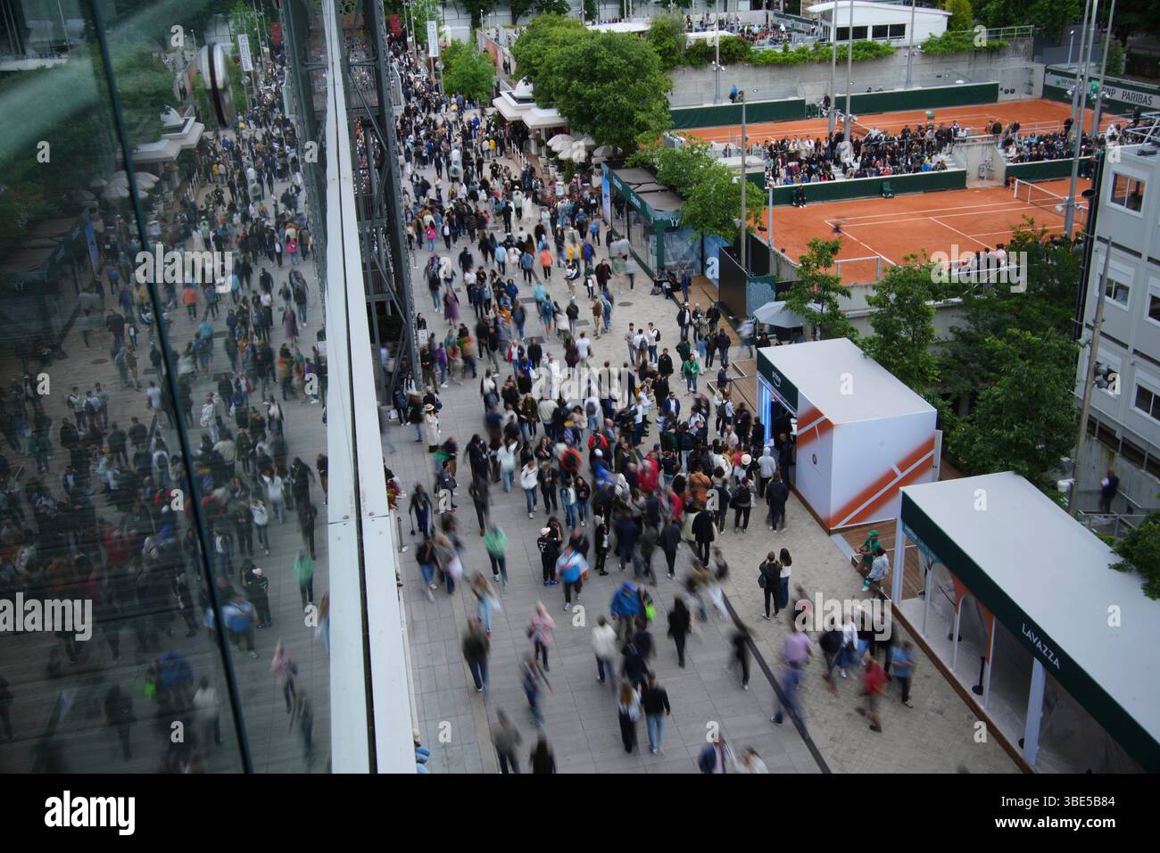 Fans walk by the courts on the occasion of the French Tennis Open, at ...