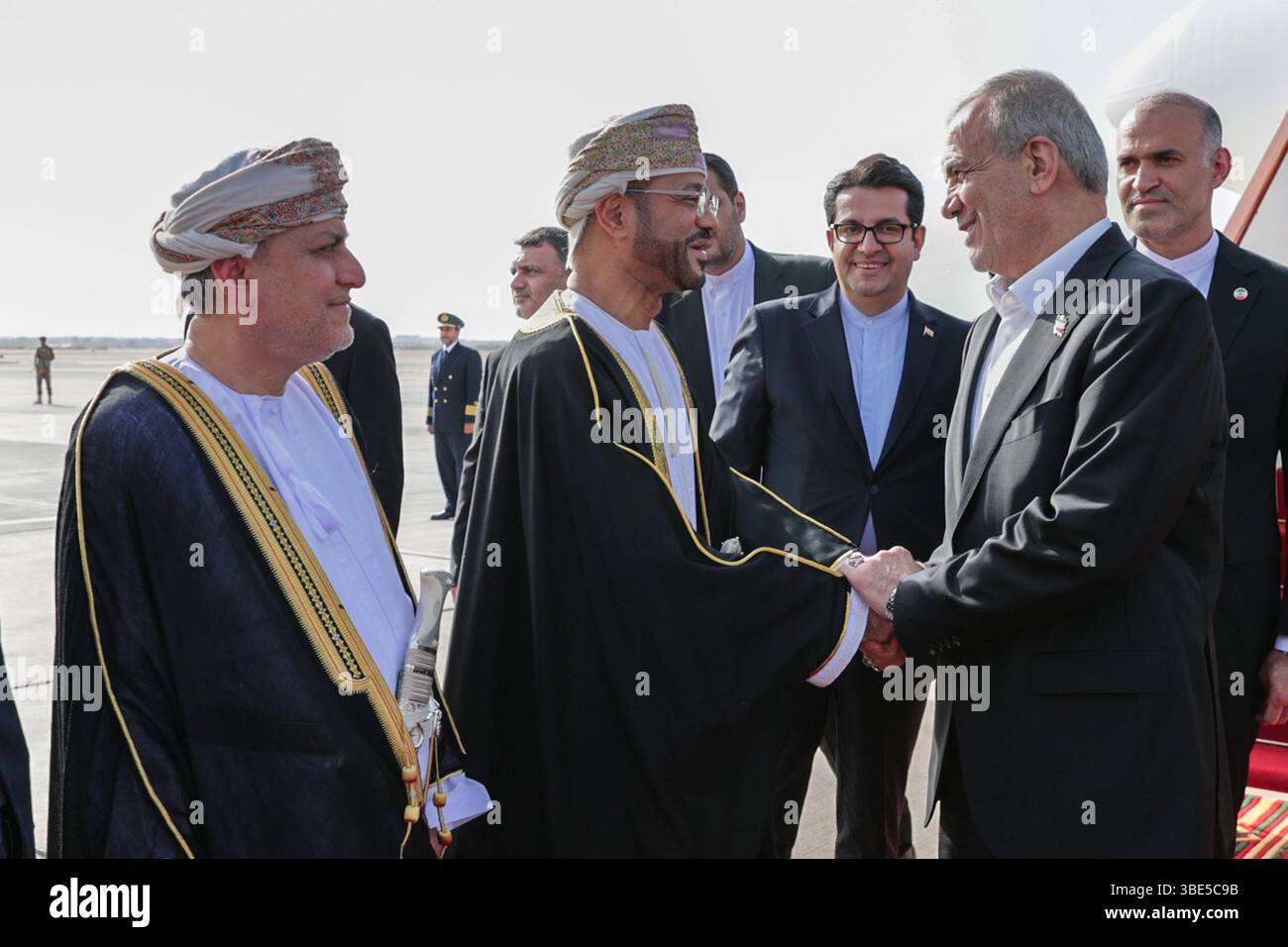 Muscat, Oman. 27th May, 2025. Iranian President MASOUD PEZESHKIAN (R ...