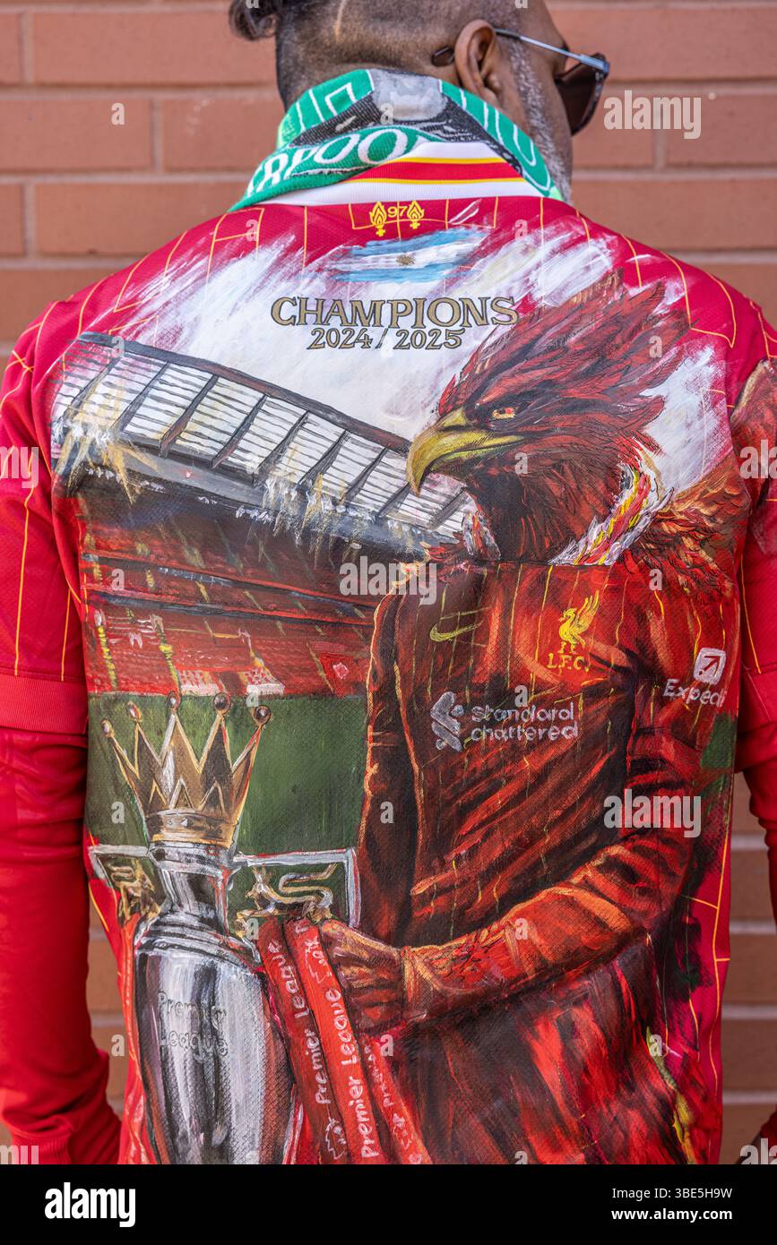 A Liverpool fan wearing a champions tribute shirt outside the ground ...