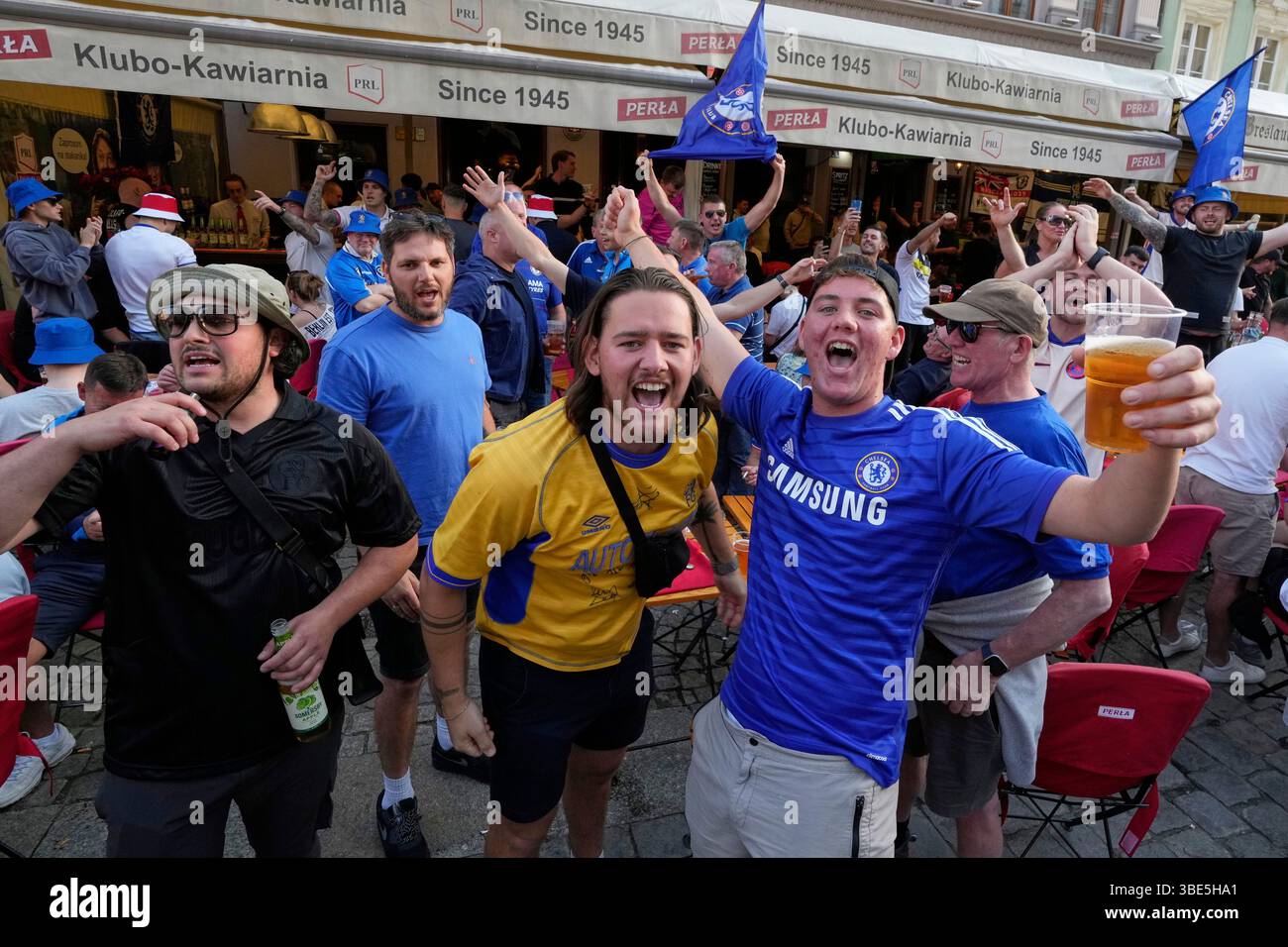 Chelsea fans cheer while gathering in the old city district ahead of ...