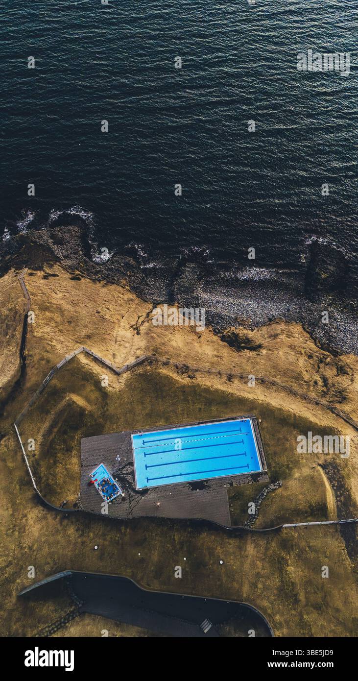Unique aerial photo of a bright blue swimming pool located on the ...