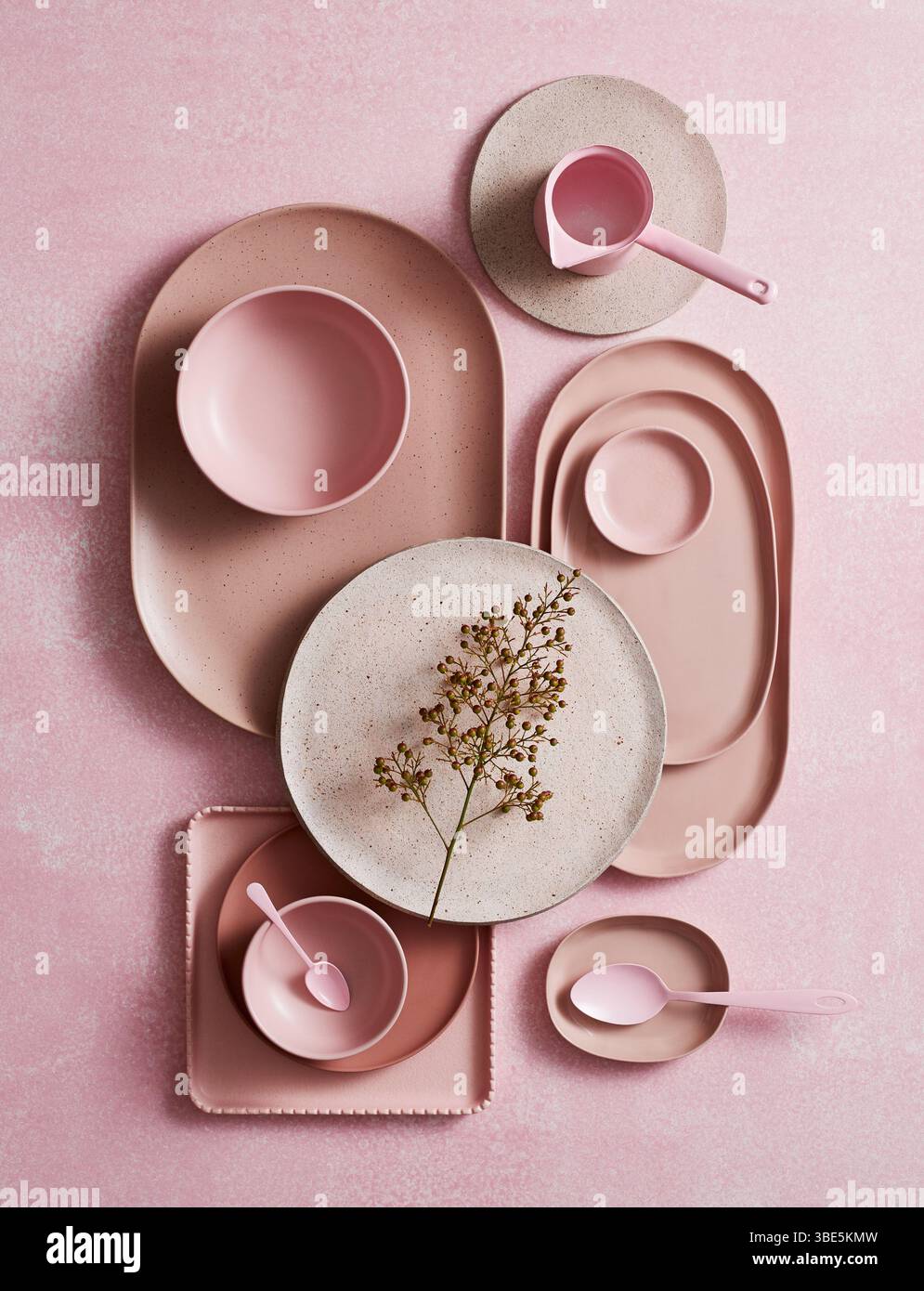 Top view of an artistic arrangement of ceramic crockery, featuring ...