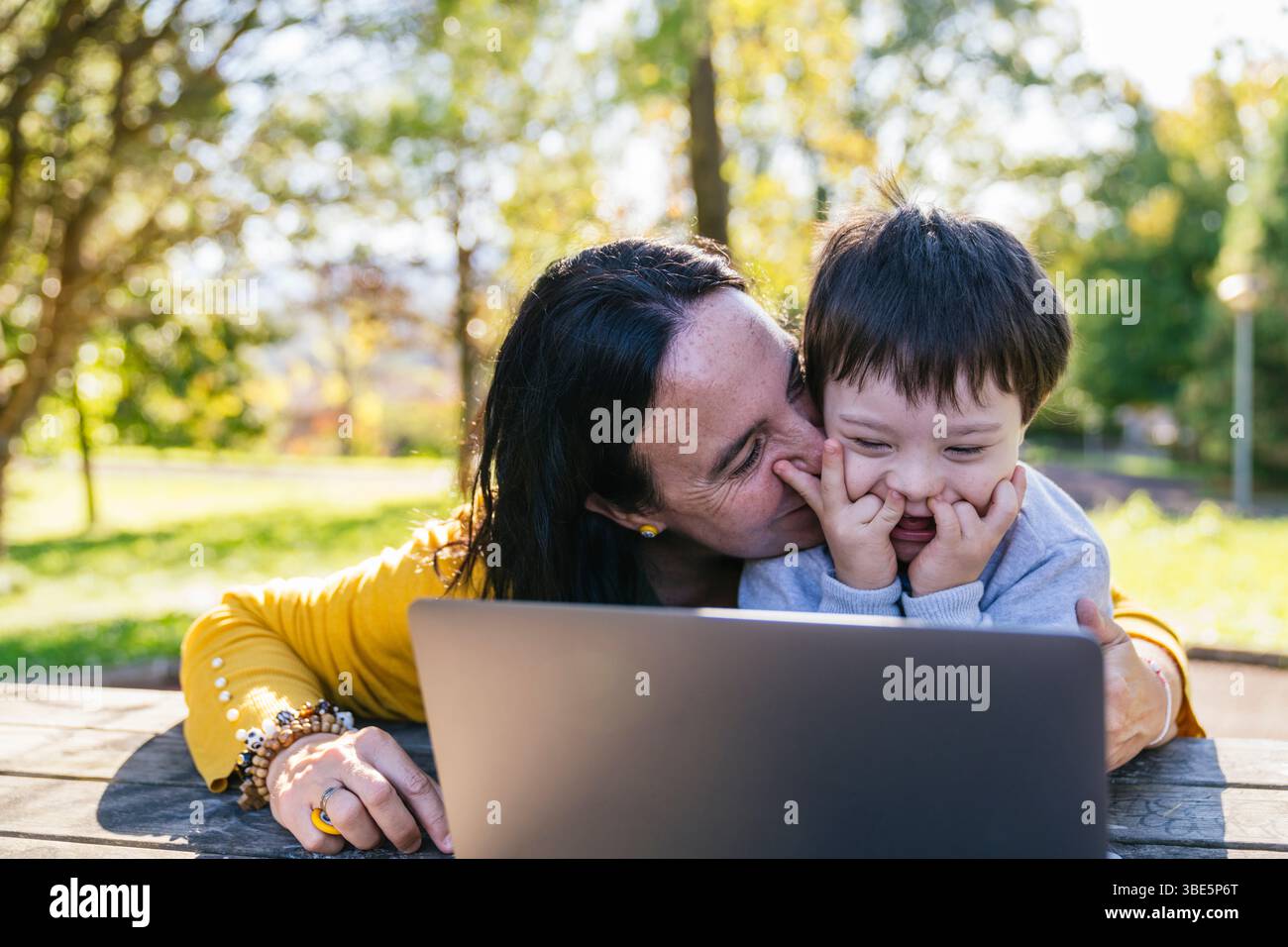 A loving mother and her child with Down syndrome enjoy quality time ...