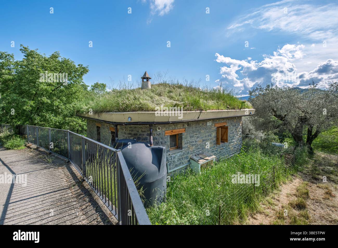 Sustainable Stone House With A Lush Green Roof And Rainwater Harvesting ...