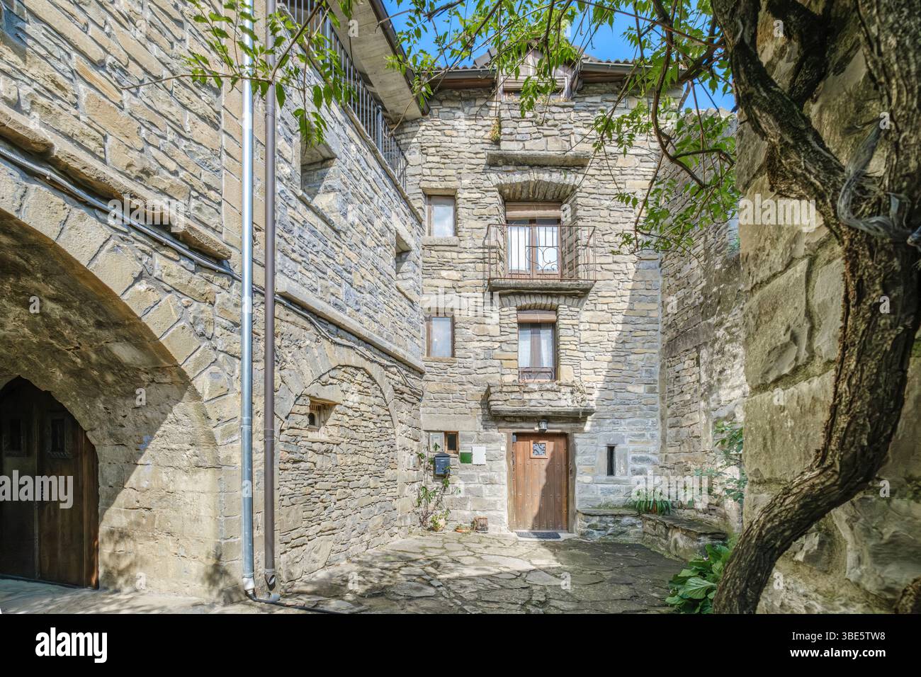 Picturesque stone courtyard in historic village featuring traditional ...