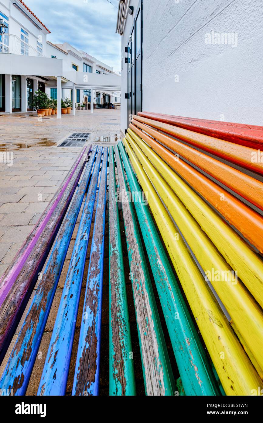 Vibrant Rainbow Colored Wooden Bench Extending Into A Modern Urban Setting. Colorful Public ...