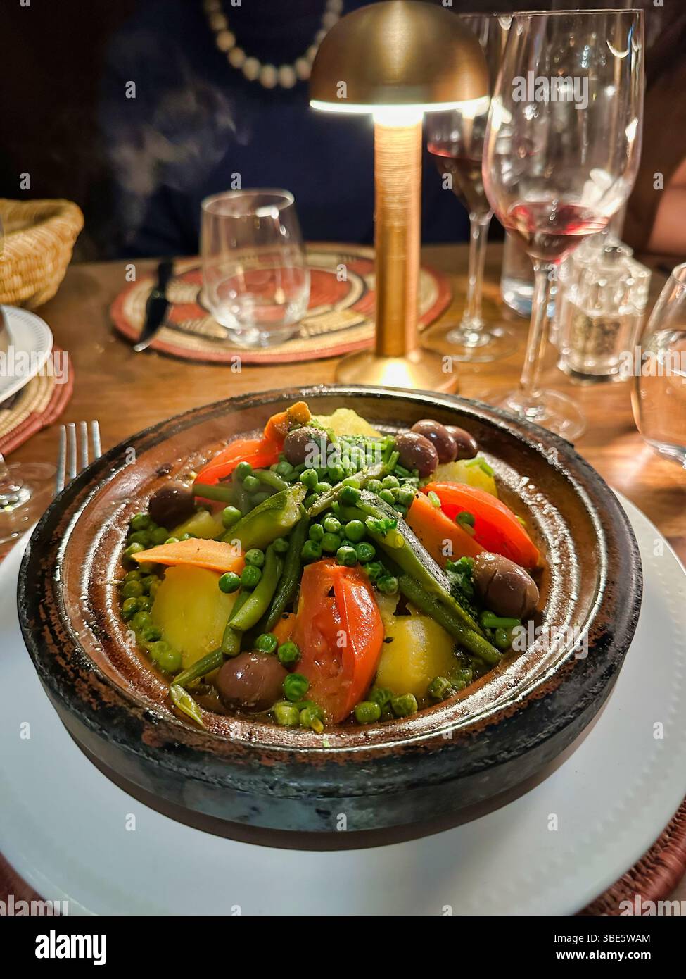 Moroccan vegetable tagine in a clay pot, dinner in traditional ...