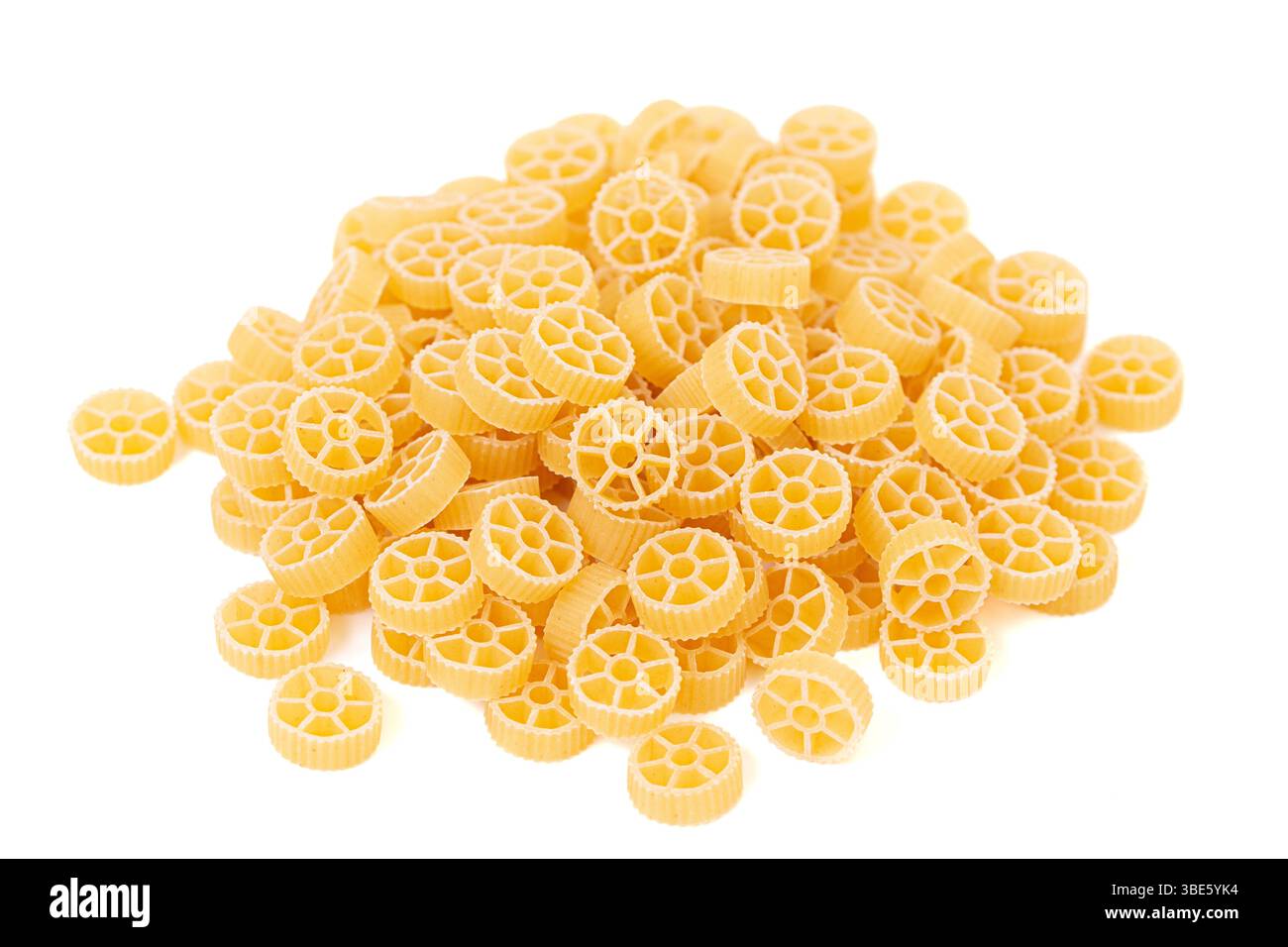 Dry Wagon Wheel Pasta isolated on a White Background Stock Photo - Alamy