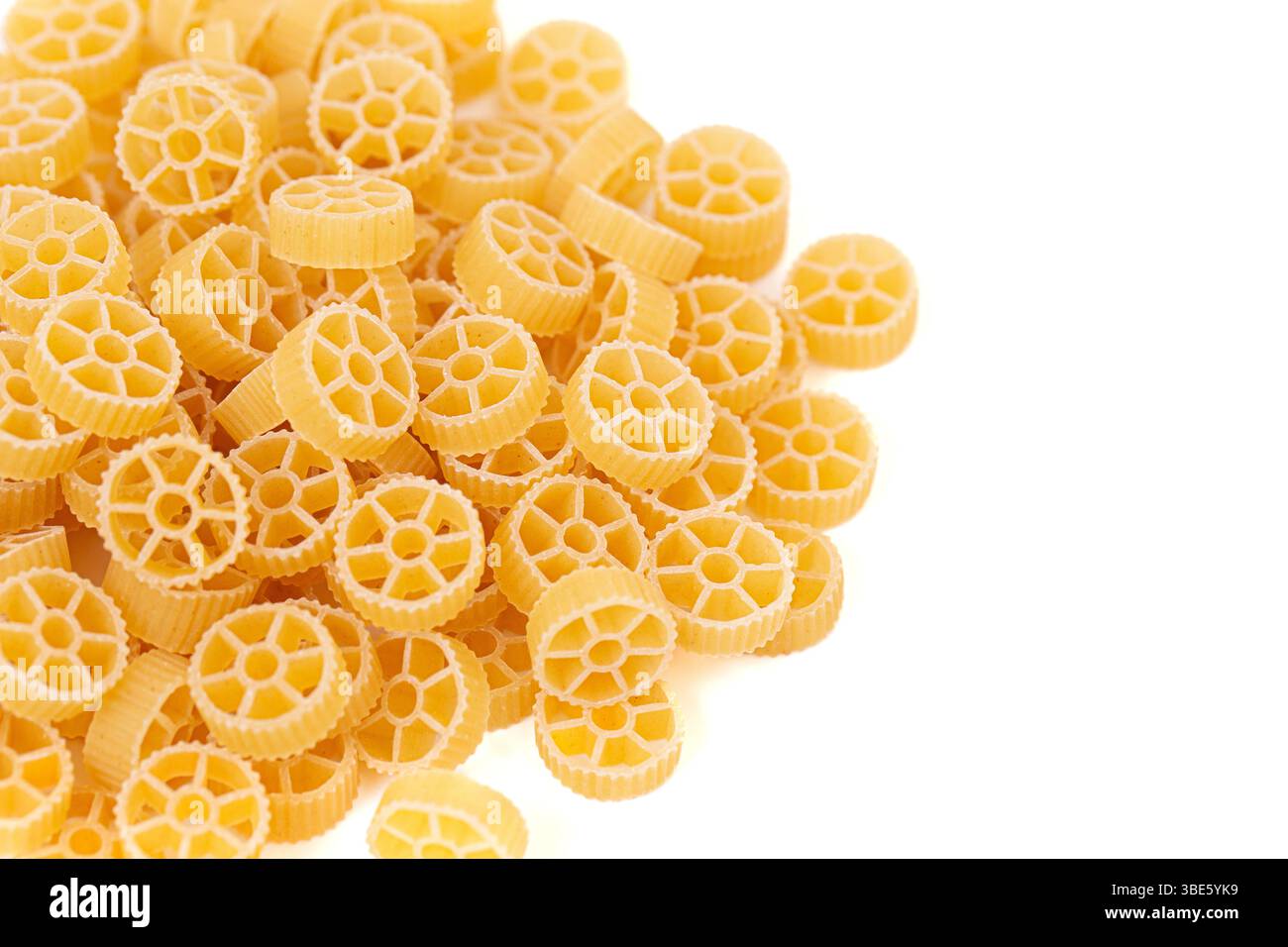 Dry Wagon Wheel Pasta isolated on a White Background Stock Photo - Alamy