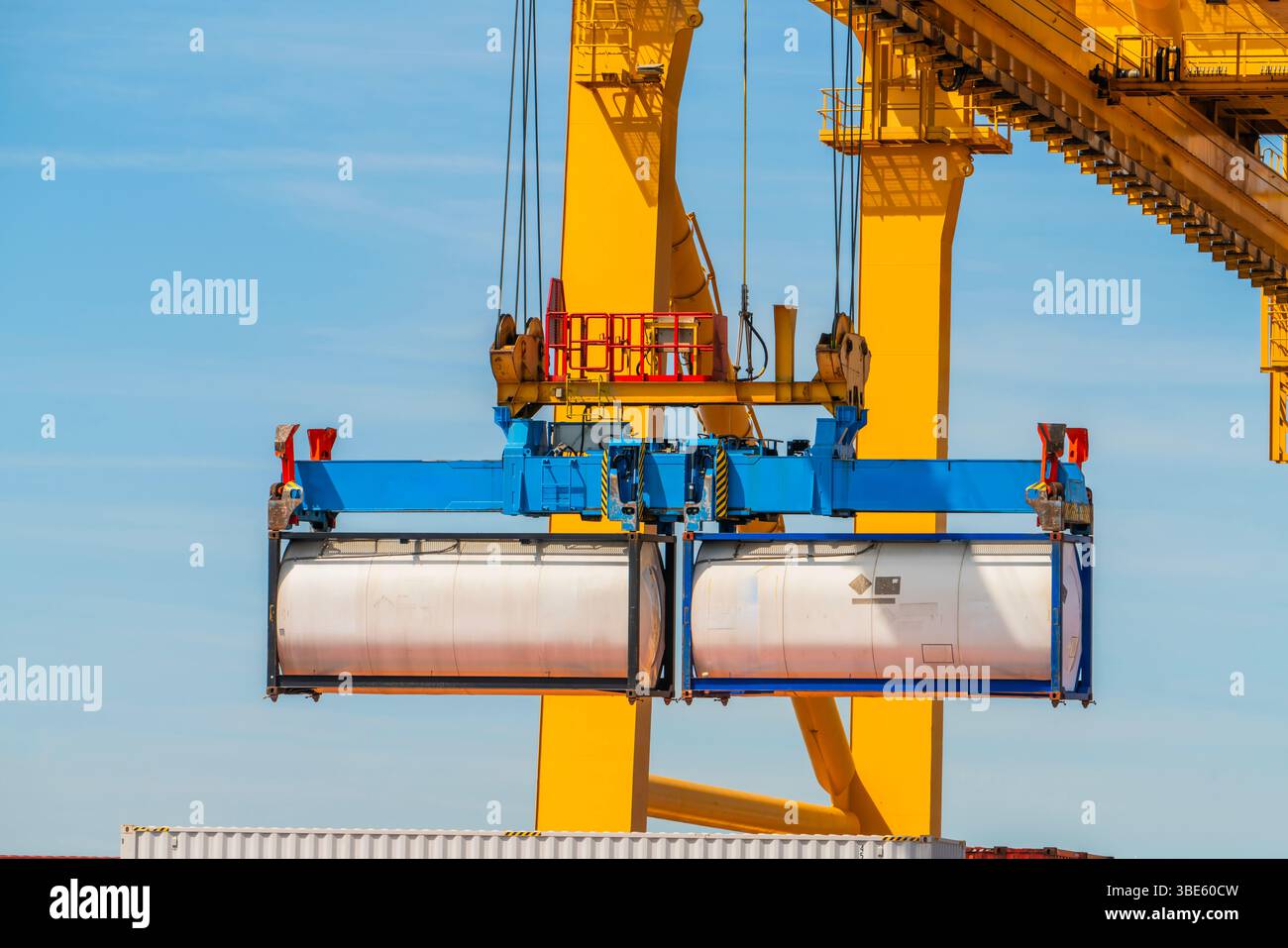 Container Crane Lifting Tank Container at Port Terminal Stock Photo - Alamy