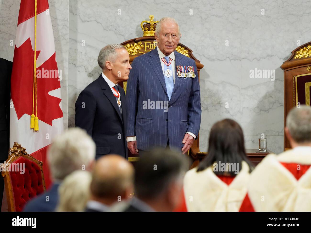 Prime Minister Mark Carney, left, and King Charles look on ahead of the ...