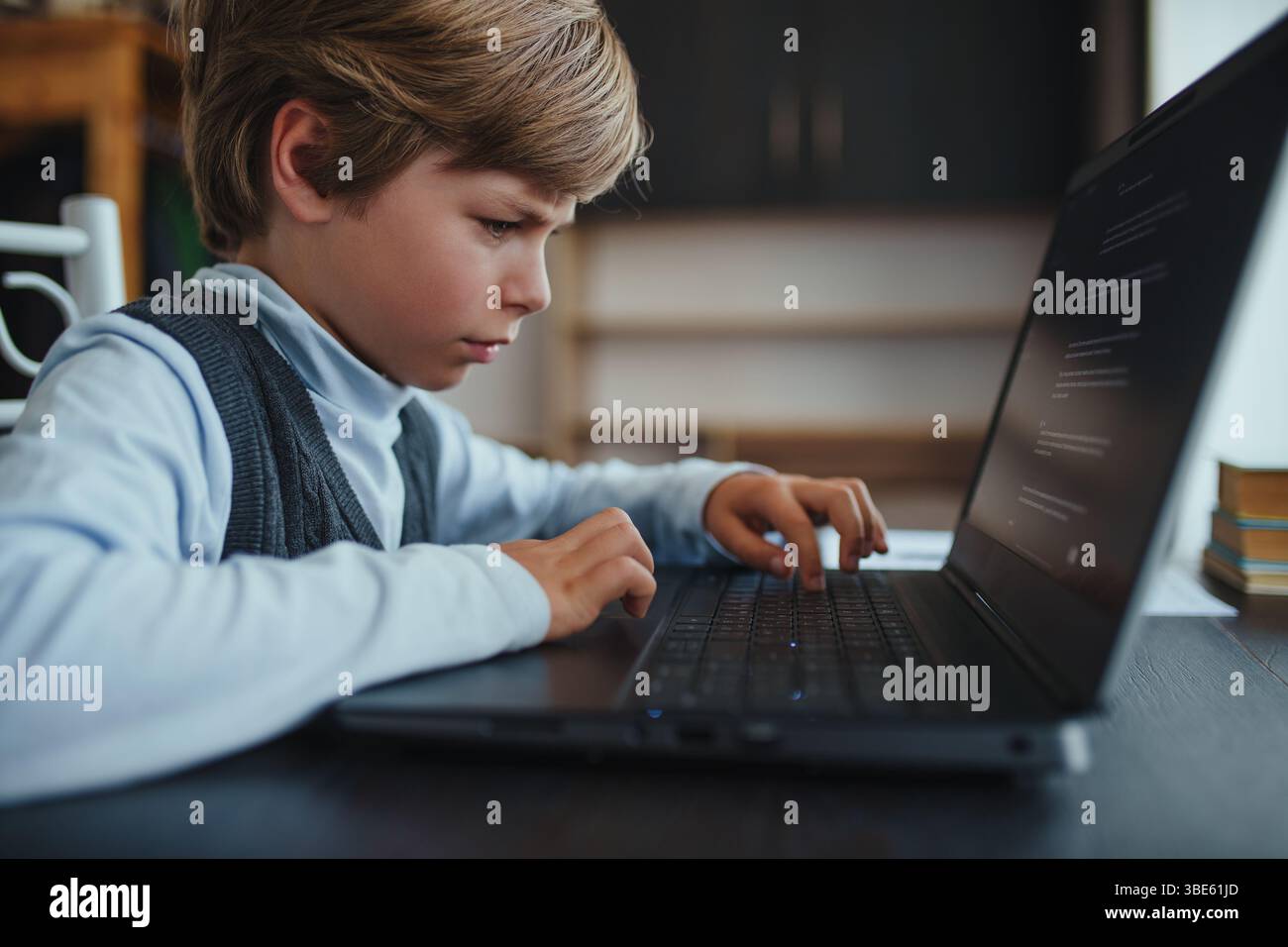Boy laptop on table hi-res stock photography and images - Alamy