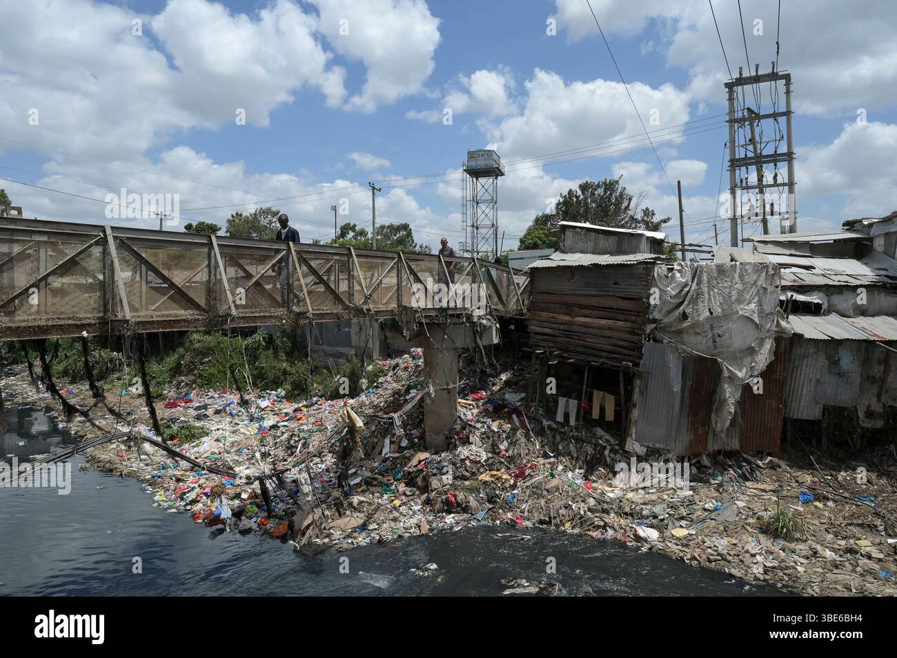 KENYA, Nairobi, slum Mukuru, polluted river with sewage and plastic ...