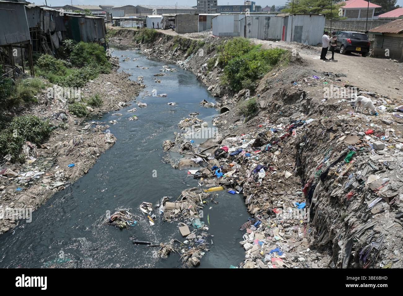 KENYA, Nairobi, slum Mukuru, polluted river with sewage and plastic ...