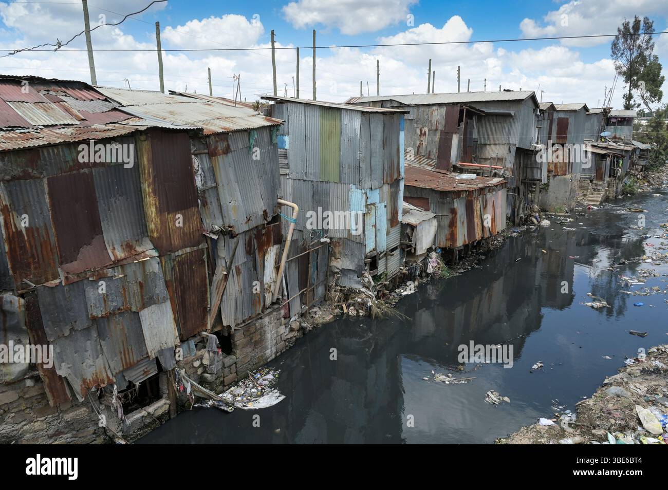 KENYA, Nairobi, slum Mukuru, polluted river with sewage and plastic ...