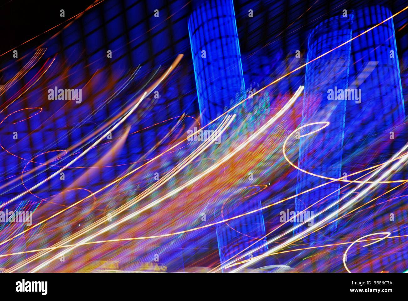 Lines and beams of lights in the darkness creating an apparent chaos ...