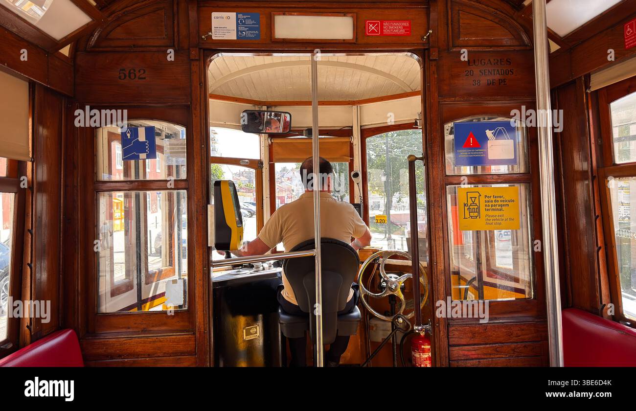Interior of an old tram in Lisbon’s Alfama district, Portugal. Driver's ...