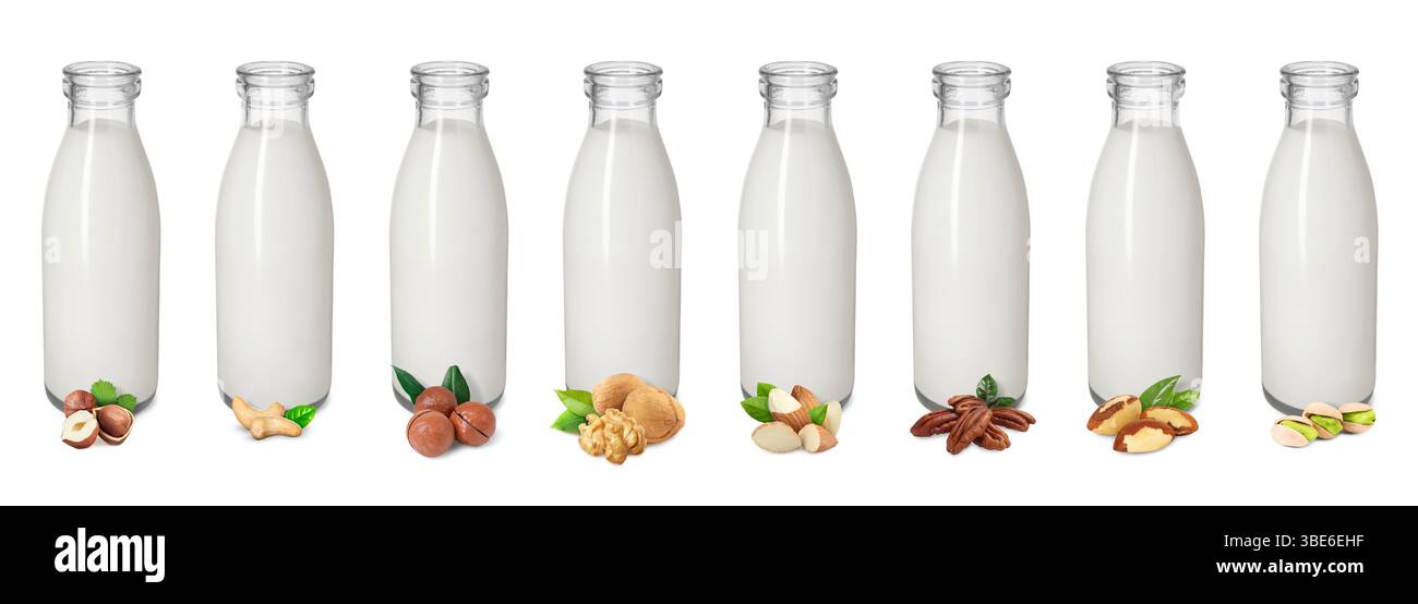 Different types of nut milk in glass bottles isolated on white, set ...