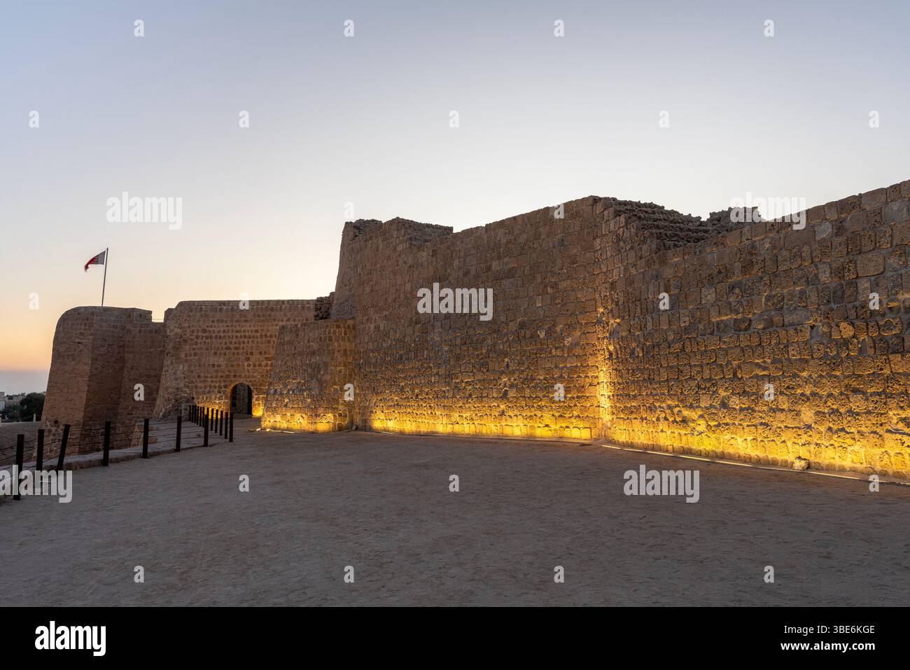 Fortified stone walls and bastions of Qalat al Bahrain Fort in Manama ...