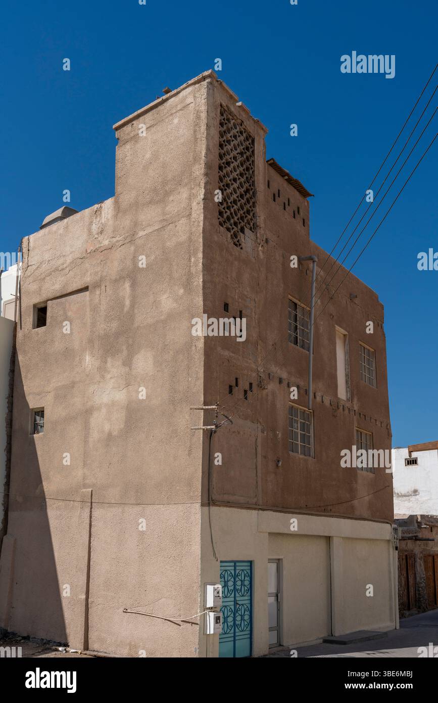 Stone tower with traditional architecture rises against blue sky on the ...