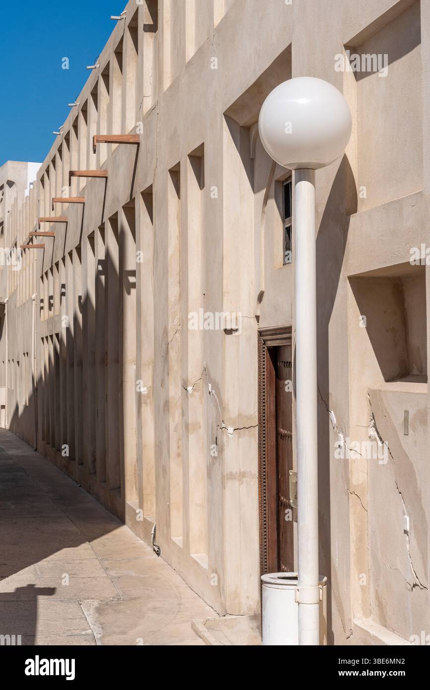 Traditional stone building with arched windows and decorative elements ...