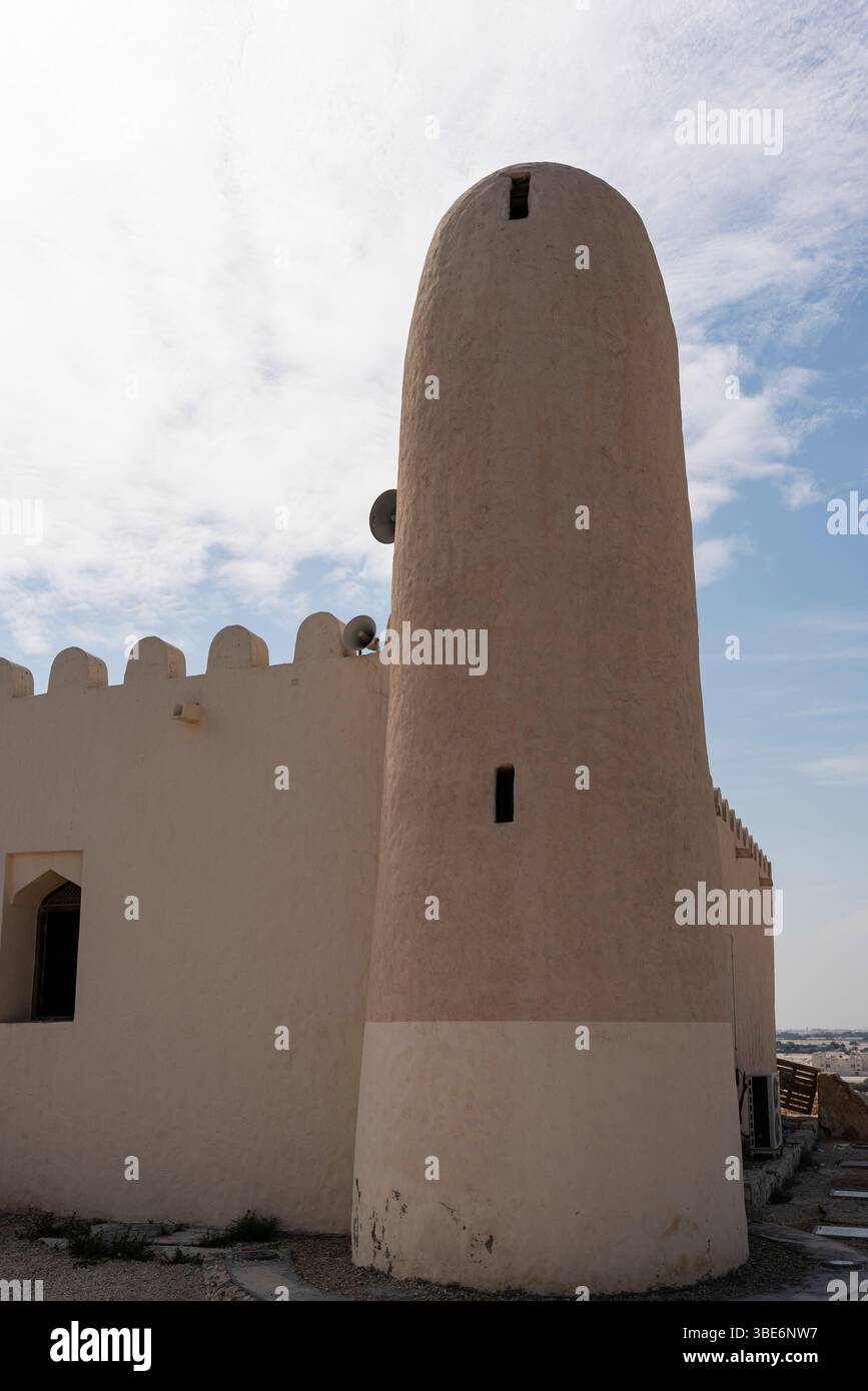 Tall white minaret with cylindrical design rises prominently at Riffa ...