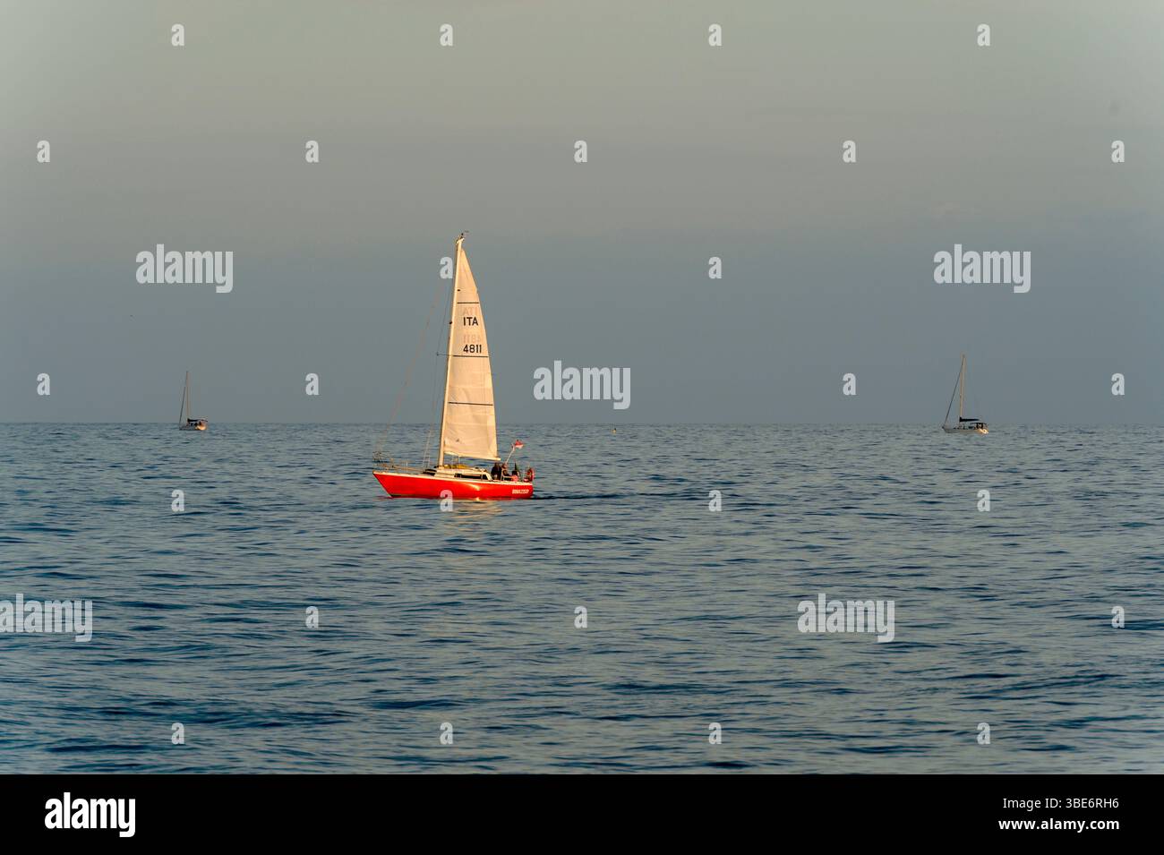 Rome, Italy. 27th May, 2025. A sailboat at sunset during the passage of ...