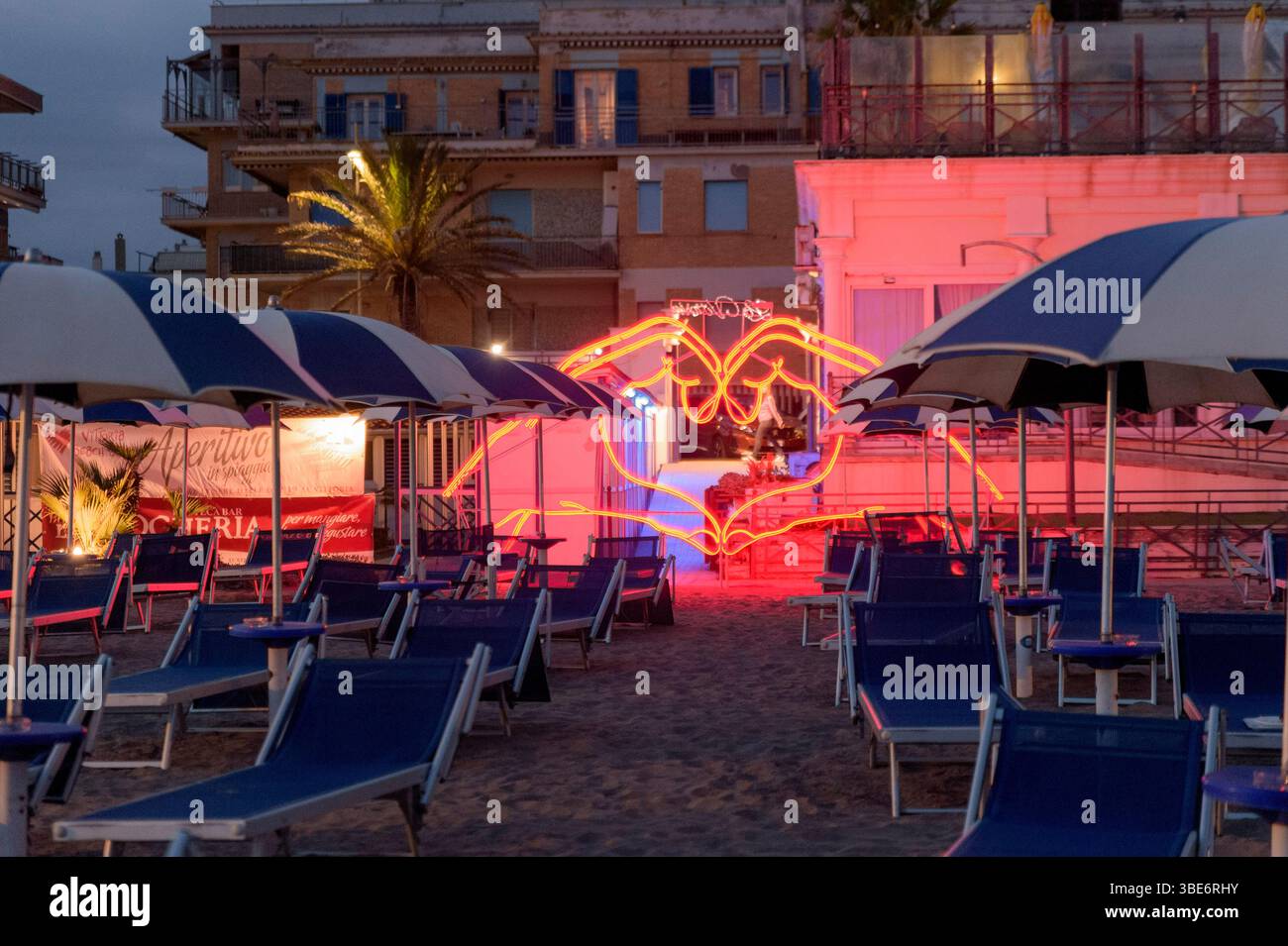 Rome, Italy. 27th May, 2025. A neon sign depicting two hands forming a ...