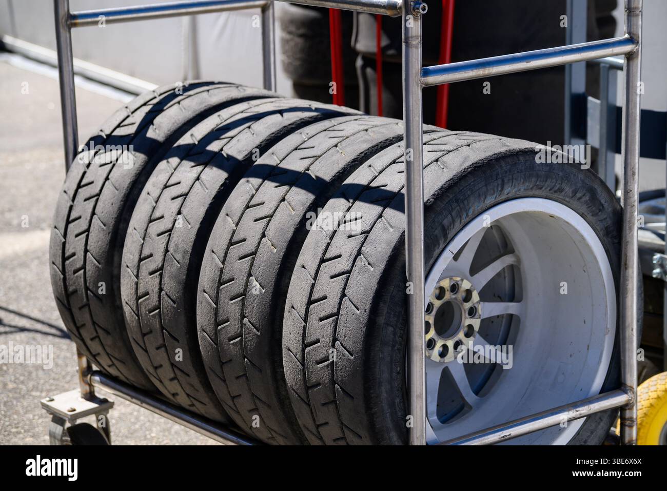 racing tires on a rack at a motorsport event, race car competition ...