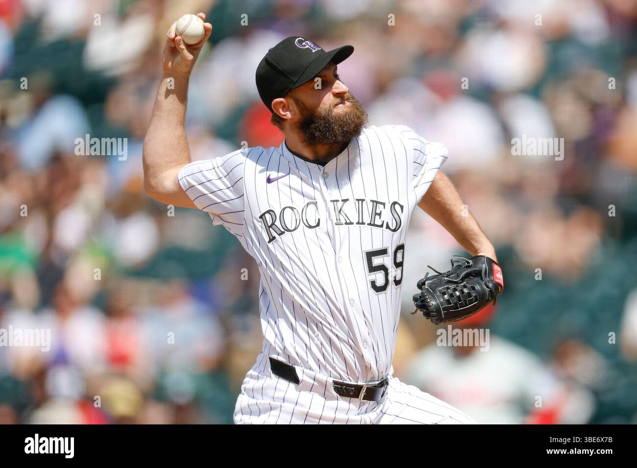 Jake Bird #59 of the Colorado Rockies throws a pitch during a game ...