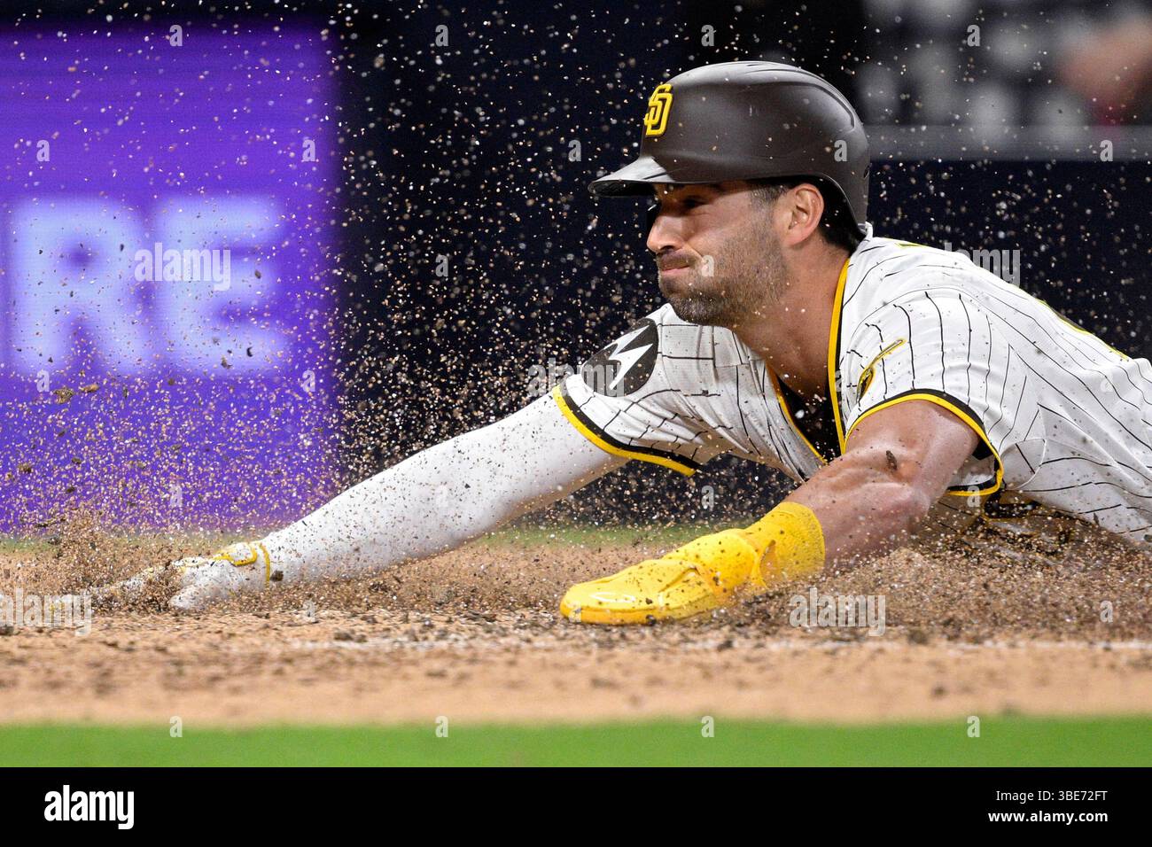 San Diego Padres' Tyler Wade scores on a wild pitch during the 11th ...