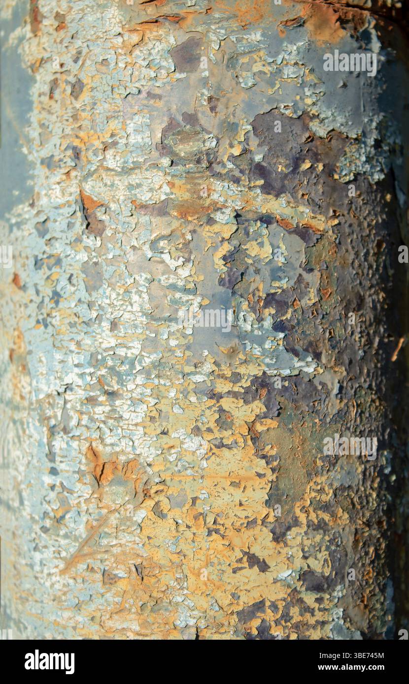 Rust on a metal pole painted blue. Natural oxidation Stock Photo - Alamy