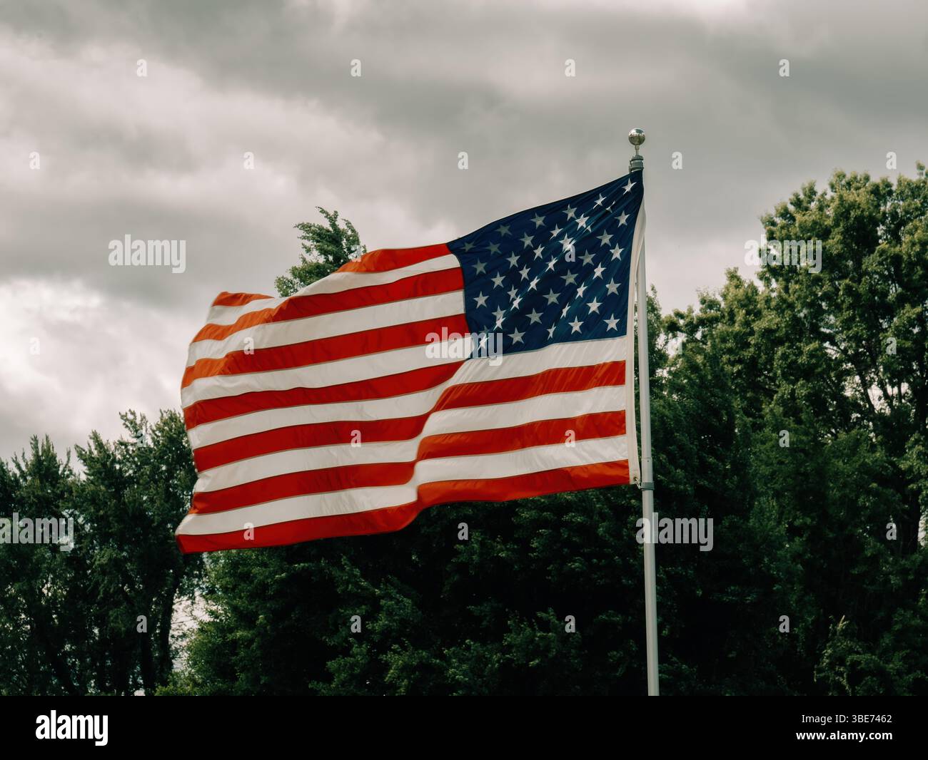 American Flag flowing in the Wind Stock Photo - Alamy
