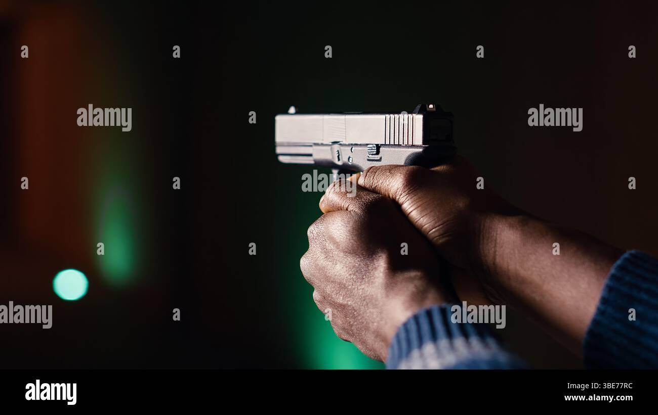 Shooting range client shoots with pistol, engaging targets at extended ...