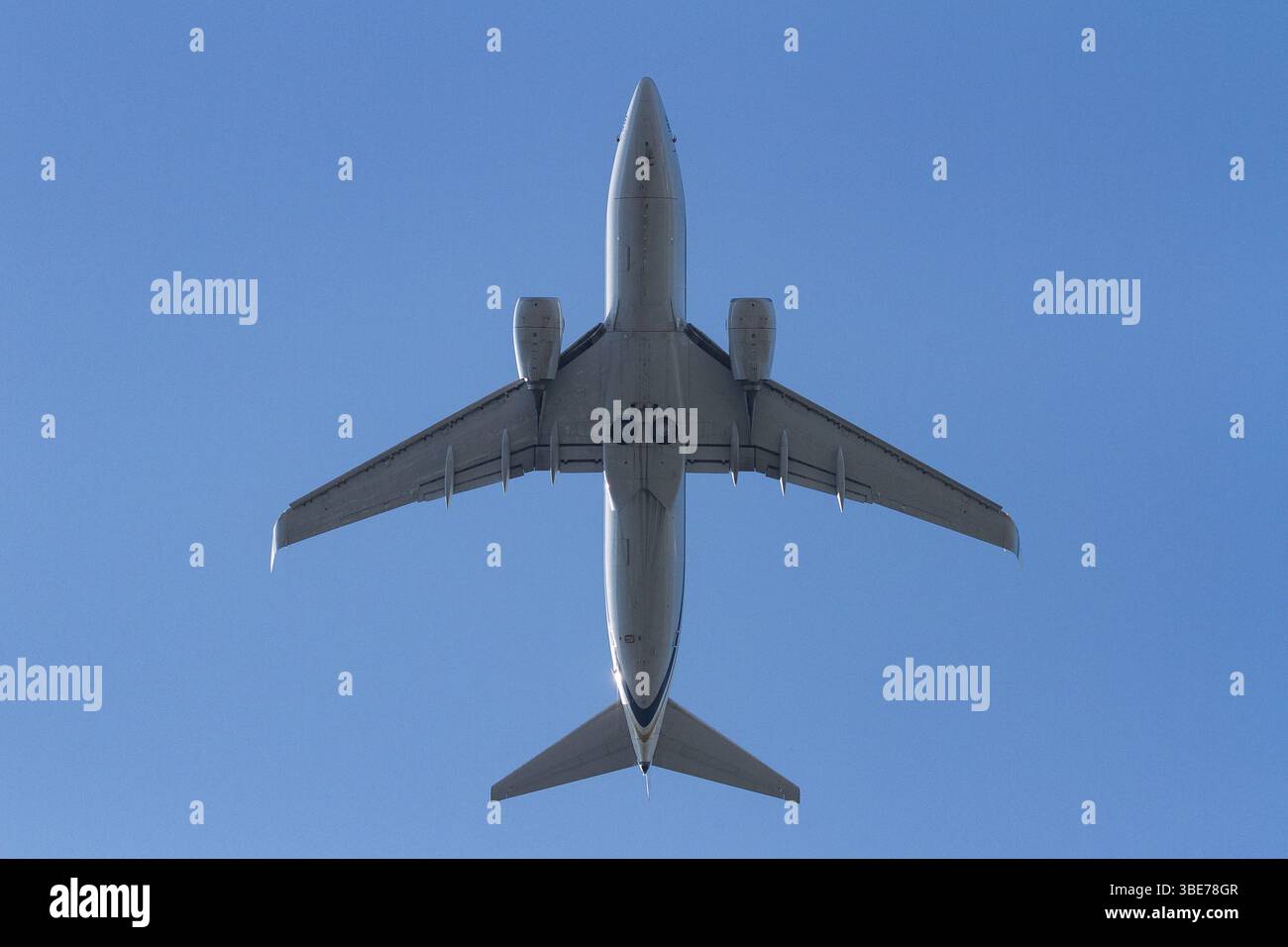 The underside of a US Navy Boeing C40A Clipper aircraft flying near NAF ...