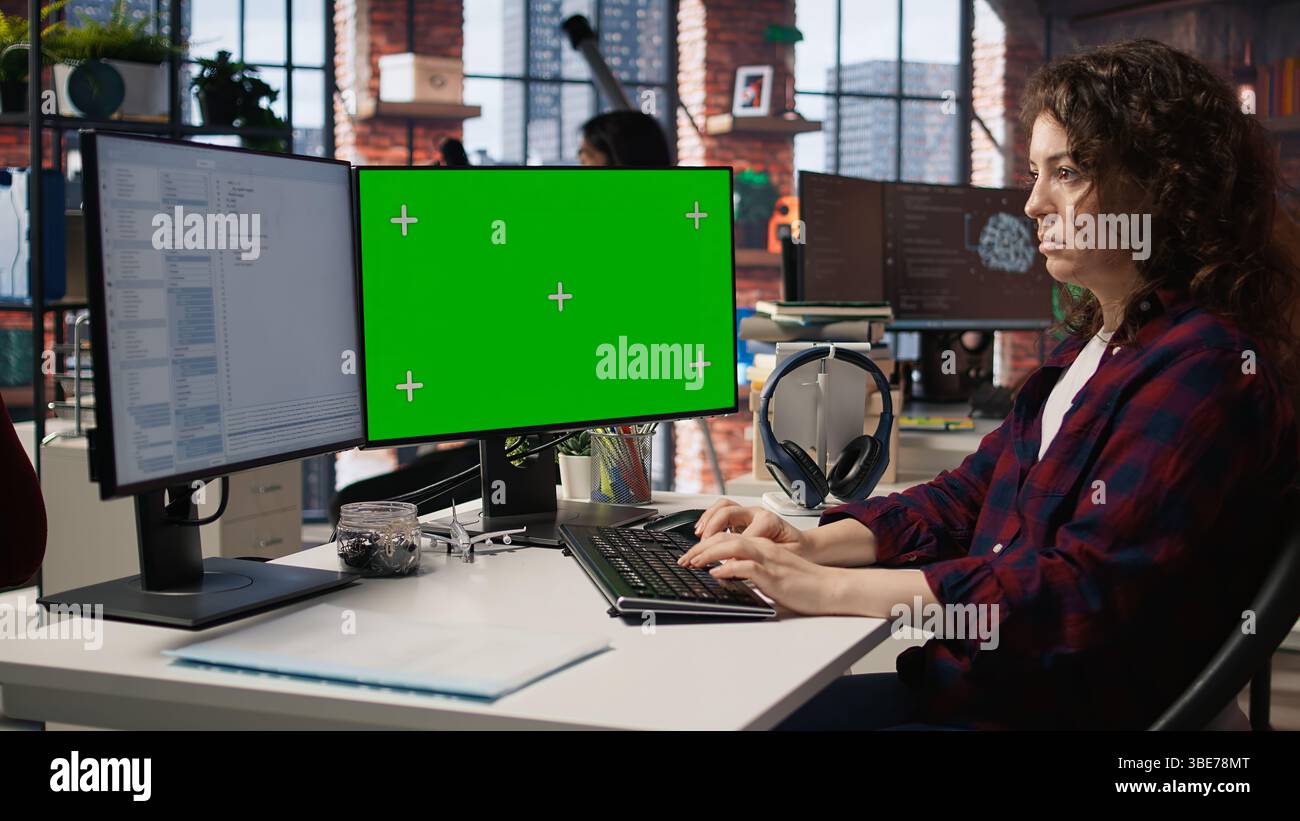 Woman coding in AI startup office using mockup PC, building scalable solutions for businesses ...