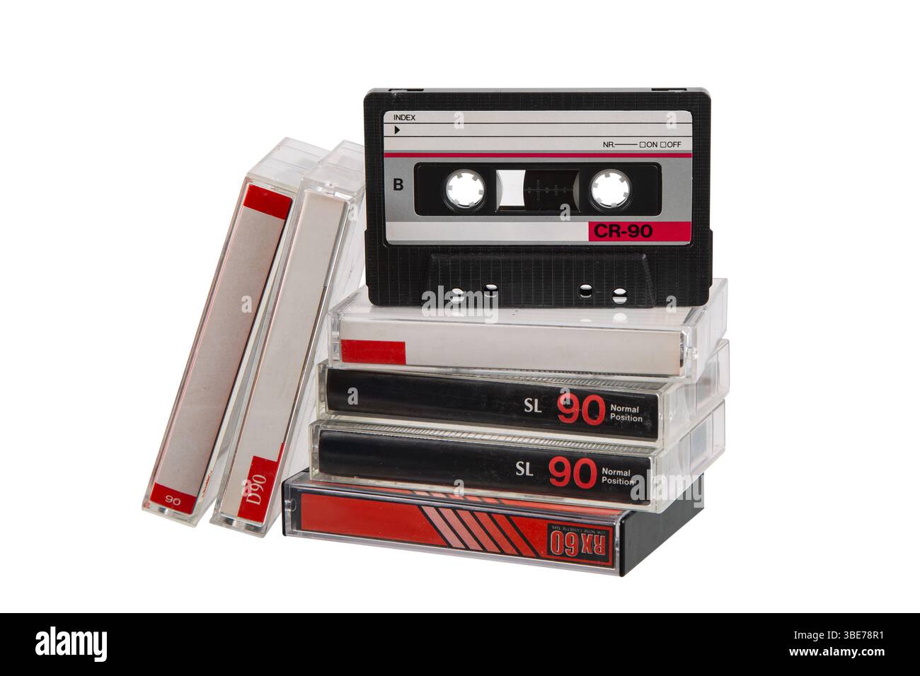 Stack of retro audio cassette tapes with one positioned upright ...