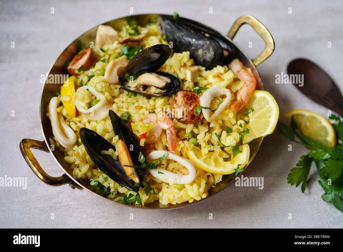Homemade Seafood Paella rice with shrimps,peas,mussels, calamari Stock ...