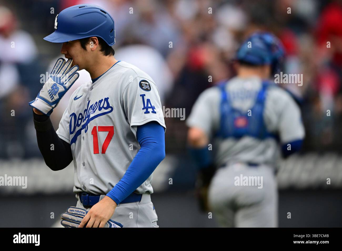 Los Angeles Dodgers' Shohei Ohtani walks to the dugout during the ...