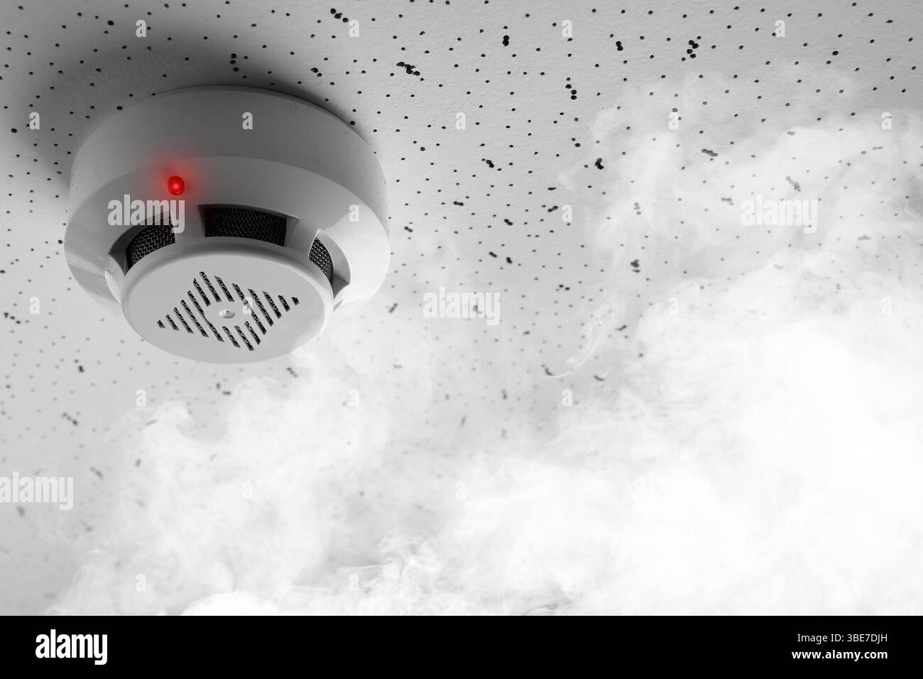 Fire alarm system. Detector on ceiling triggered by smoke Stock Photo ...